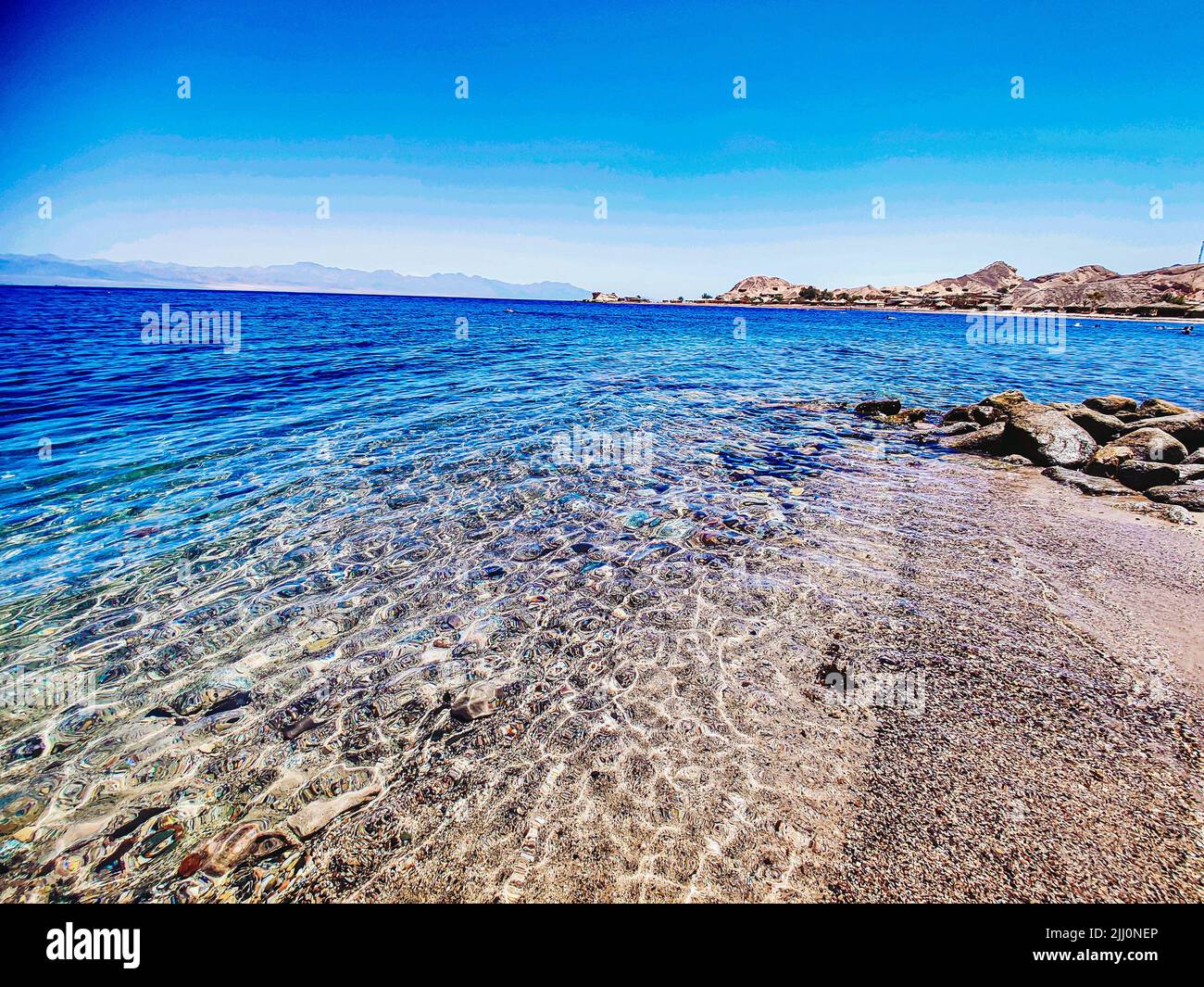 Rock and stones on the seashore on one of the beaches in Ras Shitan ...