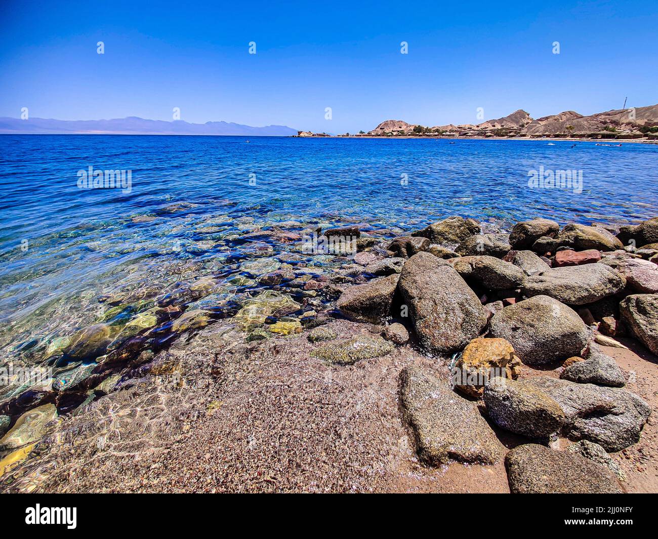Rock and stones on the seashore on one of the beaches in Ras Shitan ...
