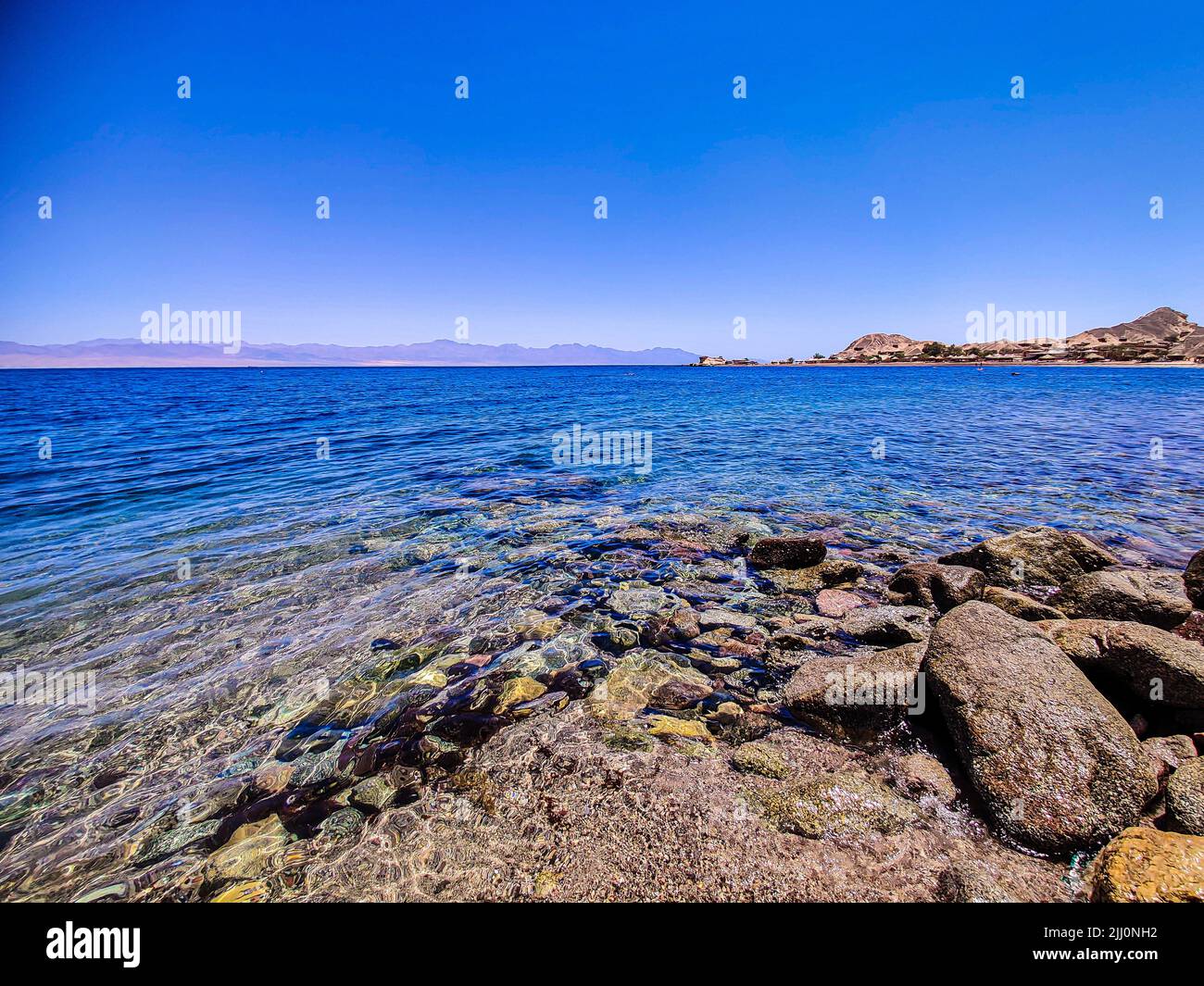 Rock and stones on the seashore on one of the beaches in Ras Shitan ...
