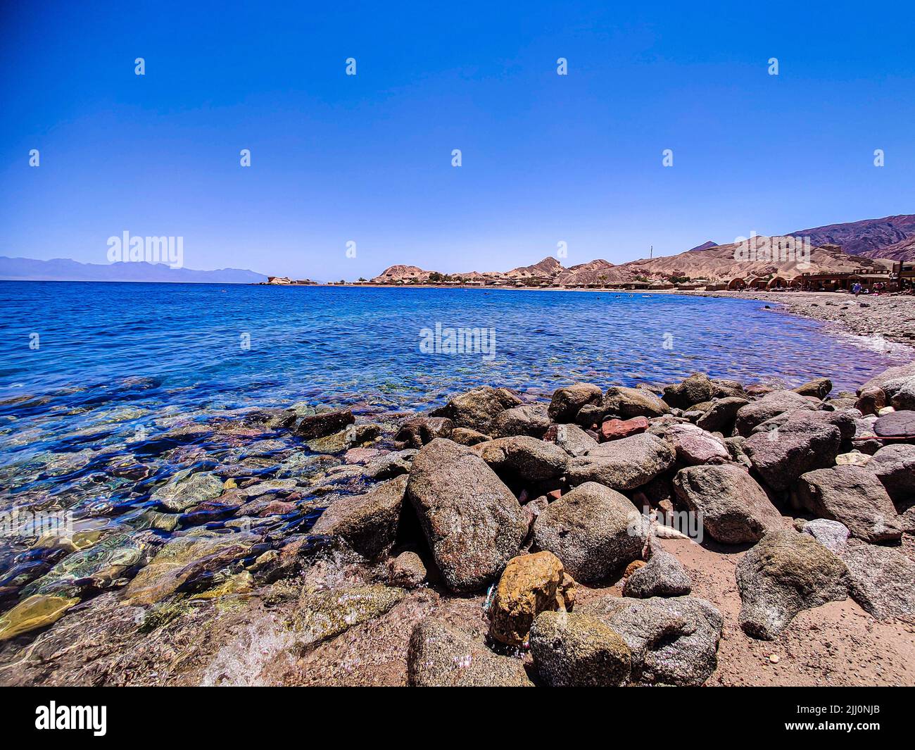 Rock and stones on the seashore on one of the beaches in Ras Shitan ...