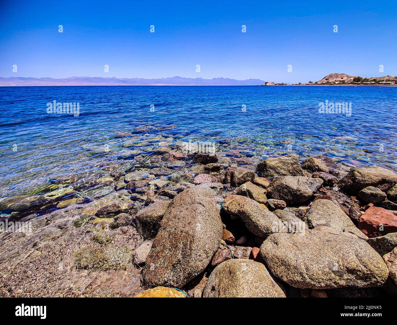 Rock and stones on the seashore on one of the beaches in Ras Shitan ...
