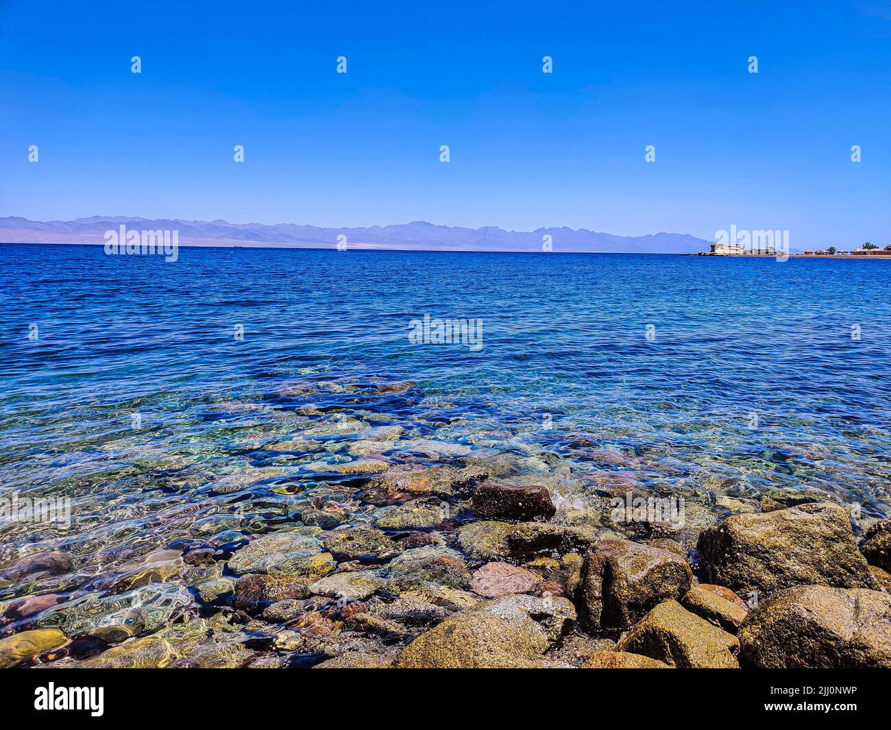 Rock and stones on the seashore on one of the beaches in Ras Shitan ...