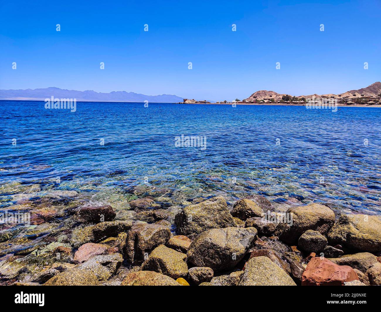 Rock and stones on the seashore on one of the beaches in Ras Shitan ...