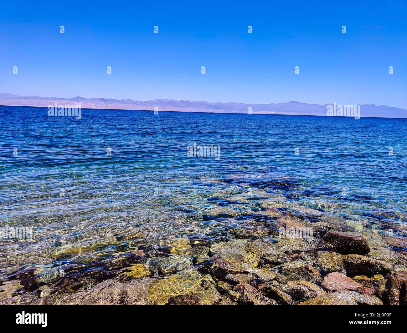 Rock and stones on the seashore on one of the beaches in Ras Shitan ...