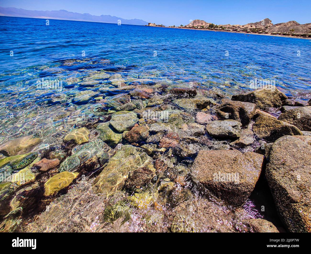 Rock and stones on the seashore on one of the beaches in Ras Shitan ...
