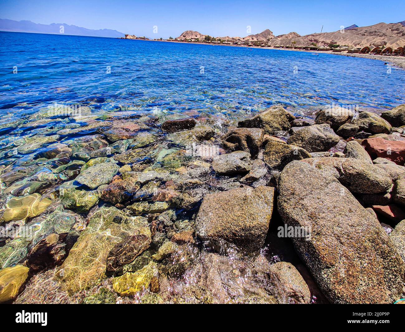 Rock and stones on the seashore on one of the beaches in Ras Shitan ...