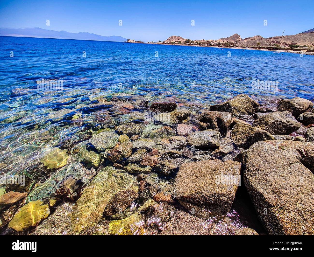 Rock and stones on the seashore on one of the beaches in Ras Shitan ...