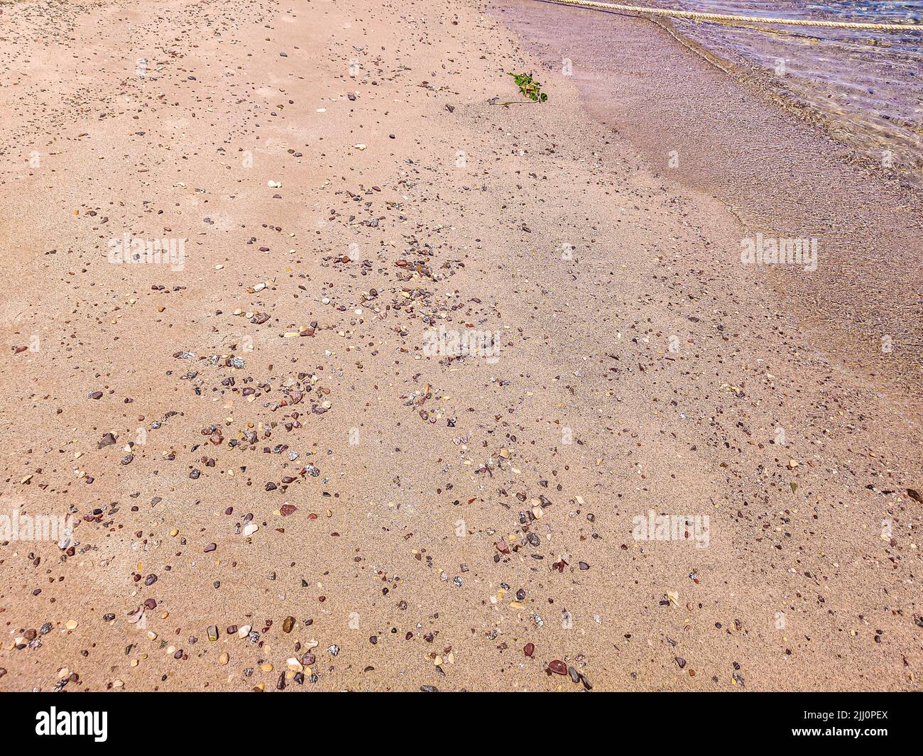 Rock and stones on the seashore on one of the beaches in Ras Shitan ...