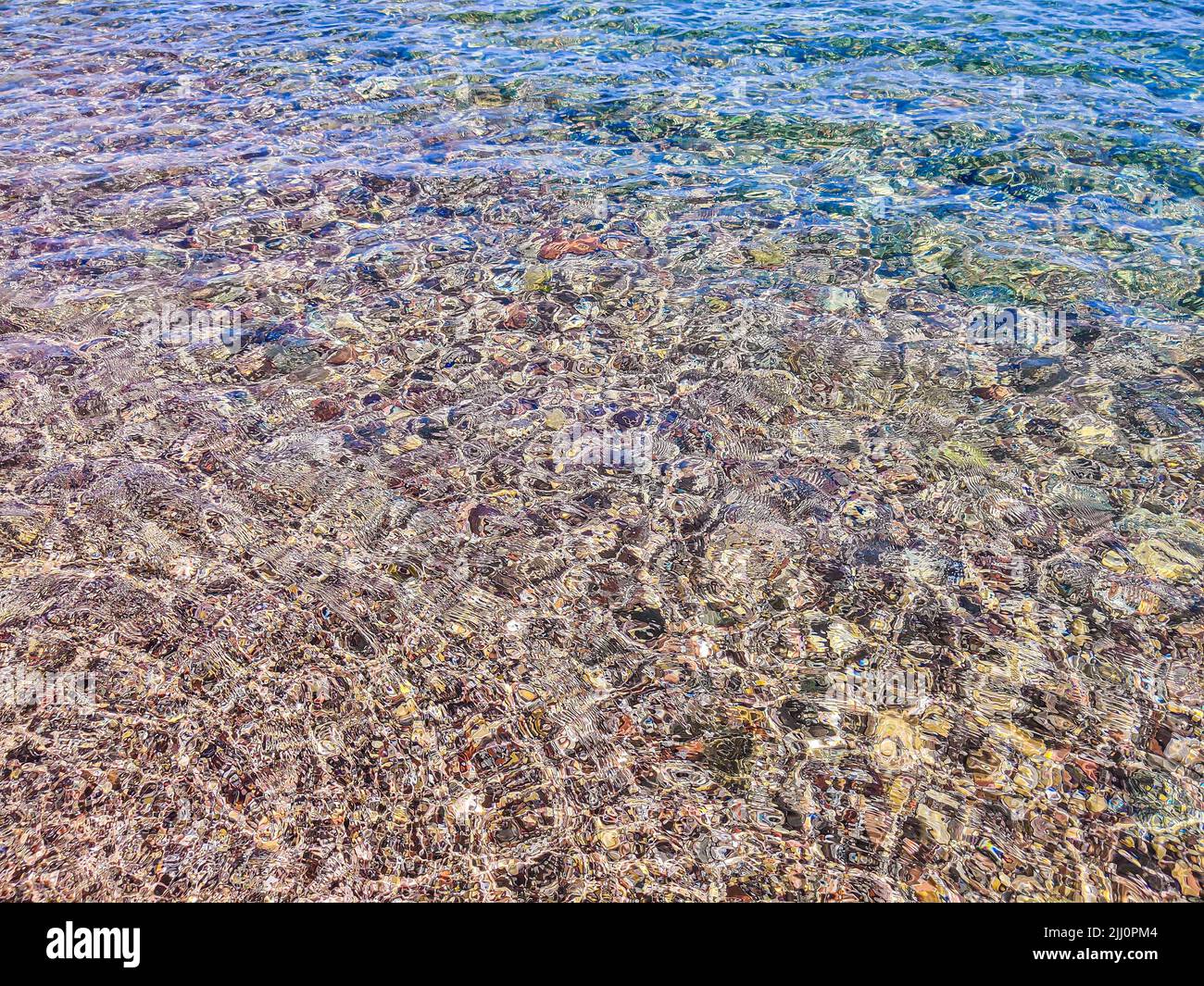 Rock and stones on the seashore on one of the beaches in Ras Shitan ...