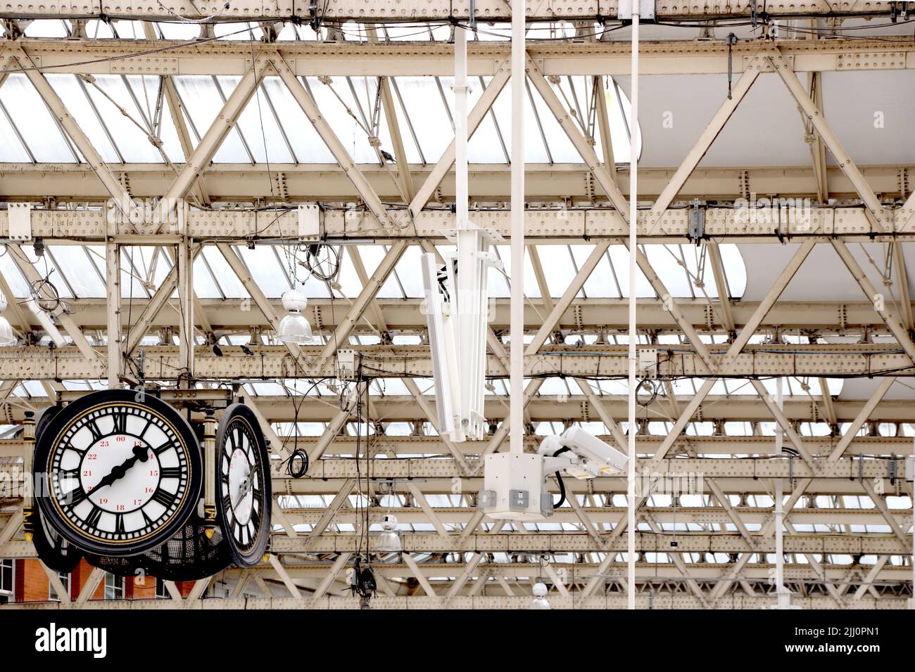 Metal structure of a white ceiling seen from below in the interior ...
