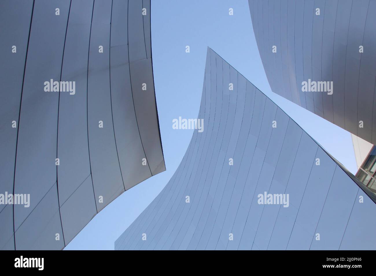 Architecture, organic surface, with an abstract shape with the sky in ...