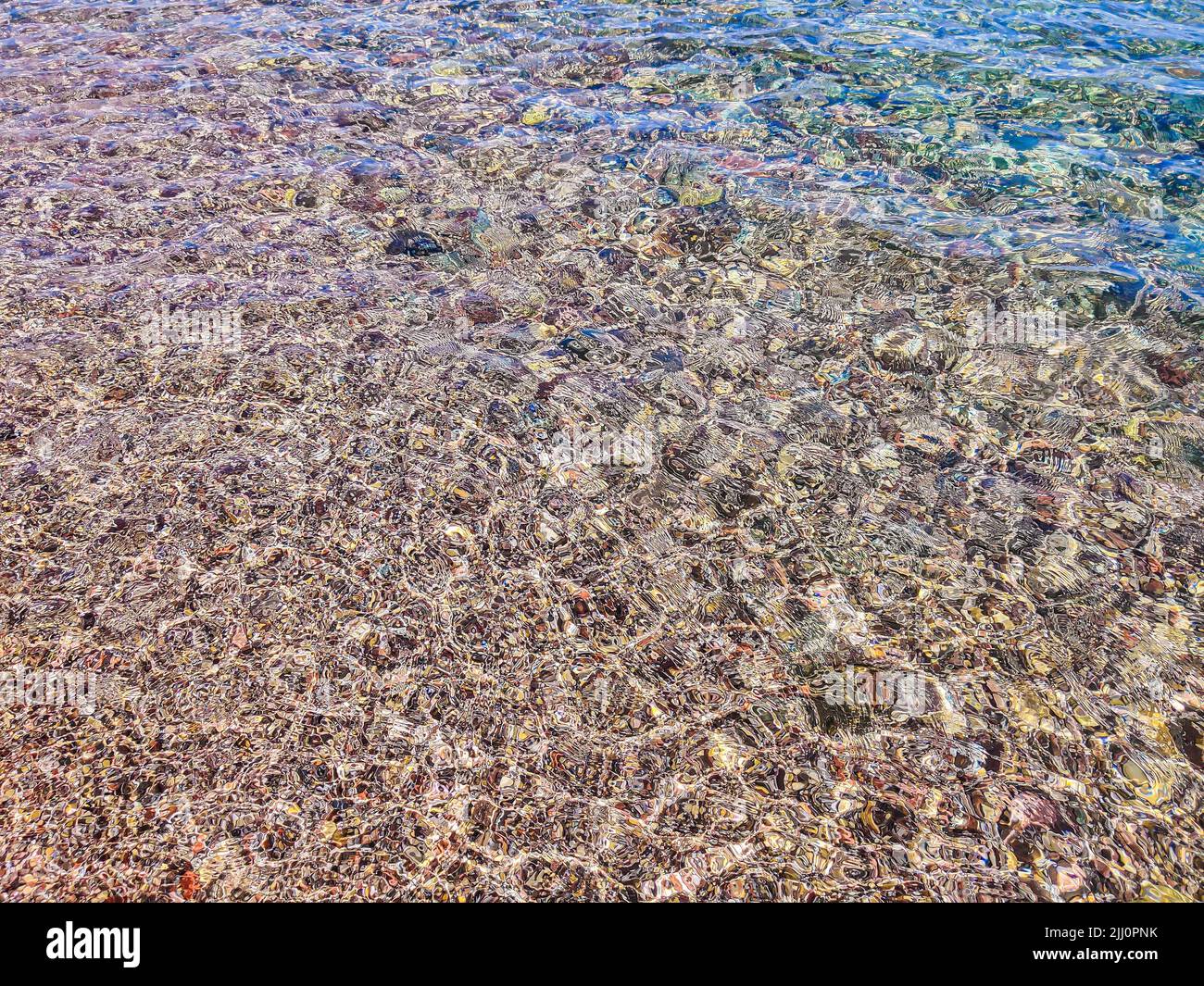 Rock and stones on the seashore on one of the beaches in Ras Shitan ...