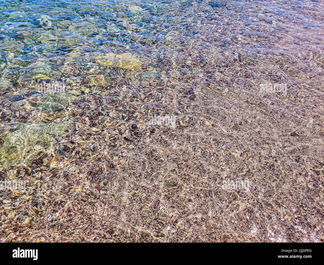Rock and stones on the seashore on one of the beaches in Ras Shitan ...