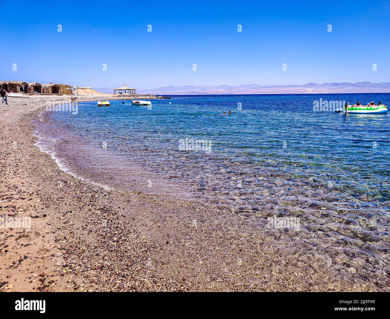 Rock and stones on the seashore on one of the beaches in Ras Shitan ...