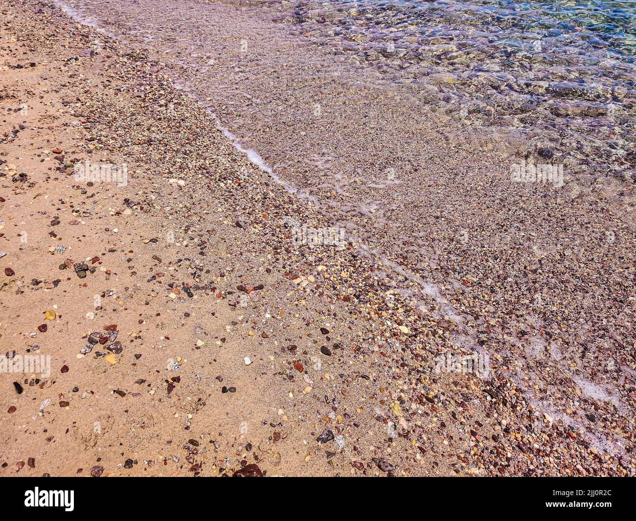 Rock and stones on the seashore on one of the beaches in Ras Shitan ...