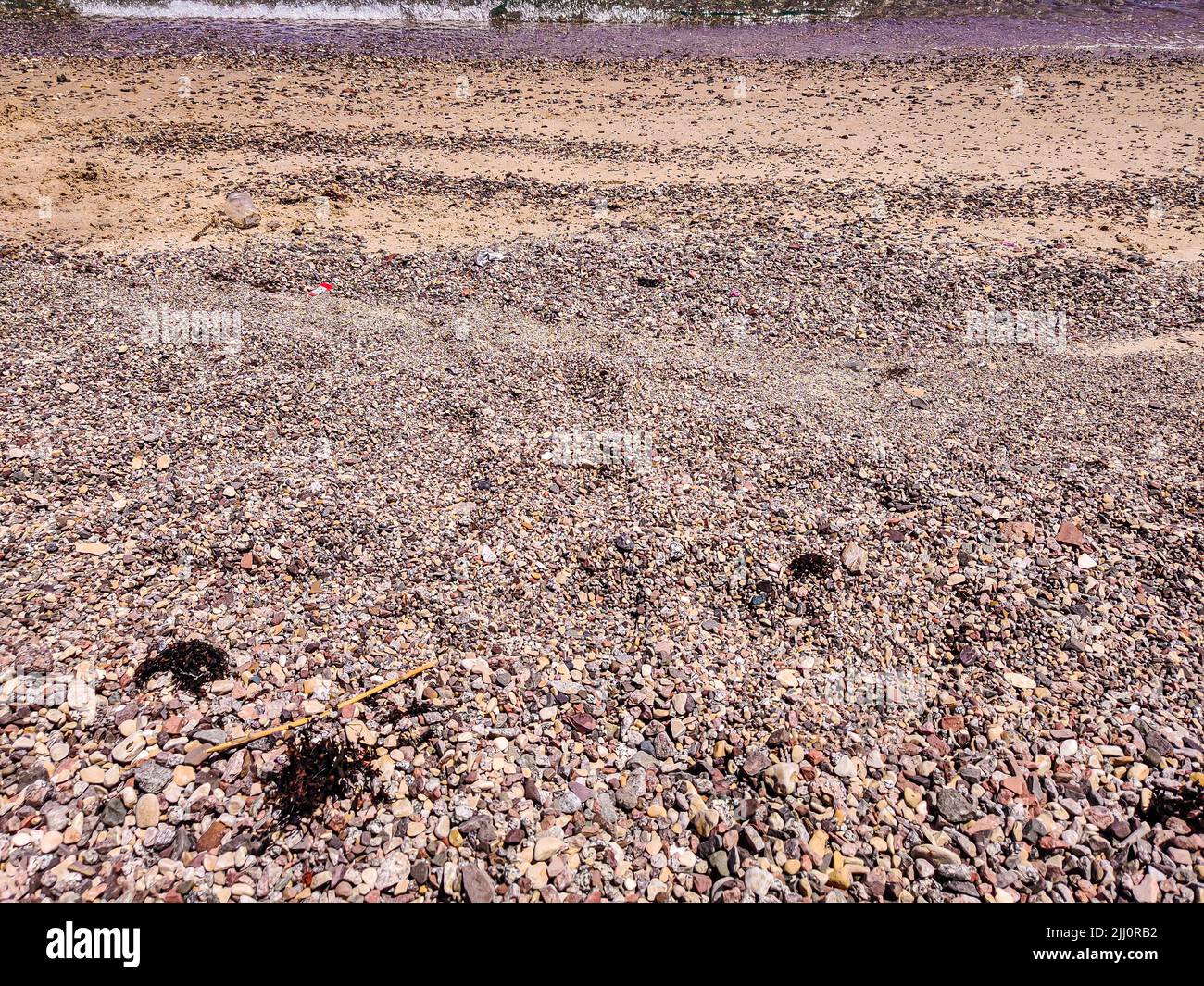 Rock and stones on the seashore on one of the beaches in Ras Shitan ...