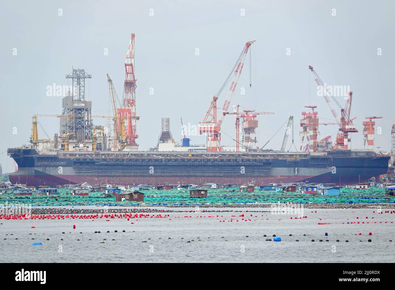 YANTAI, CHINA - JULY 21, 2022 - A large ship is under construction at ...