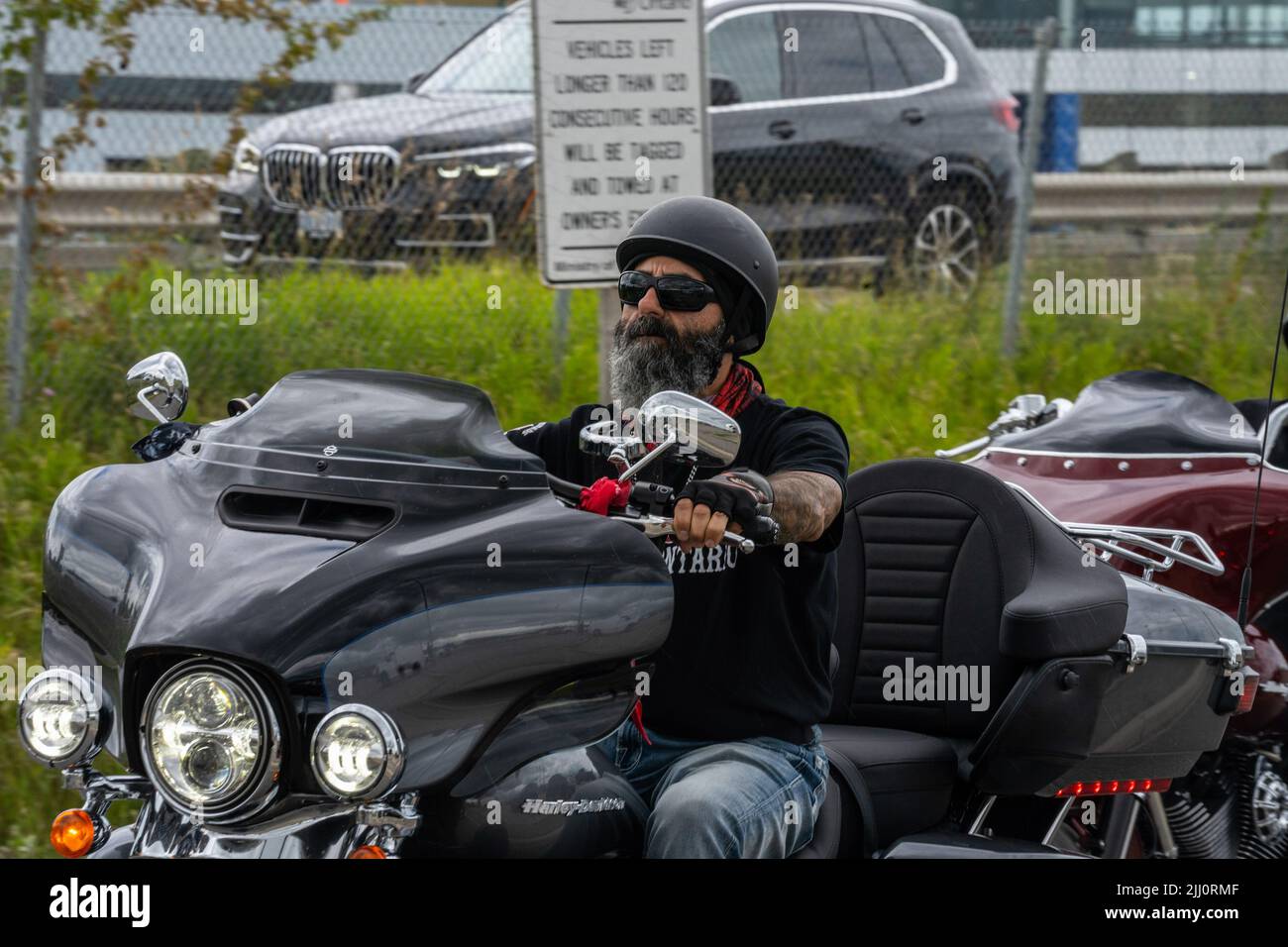 A member of the Hells Angels club takes a detour from the highway after ...