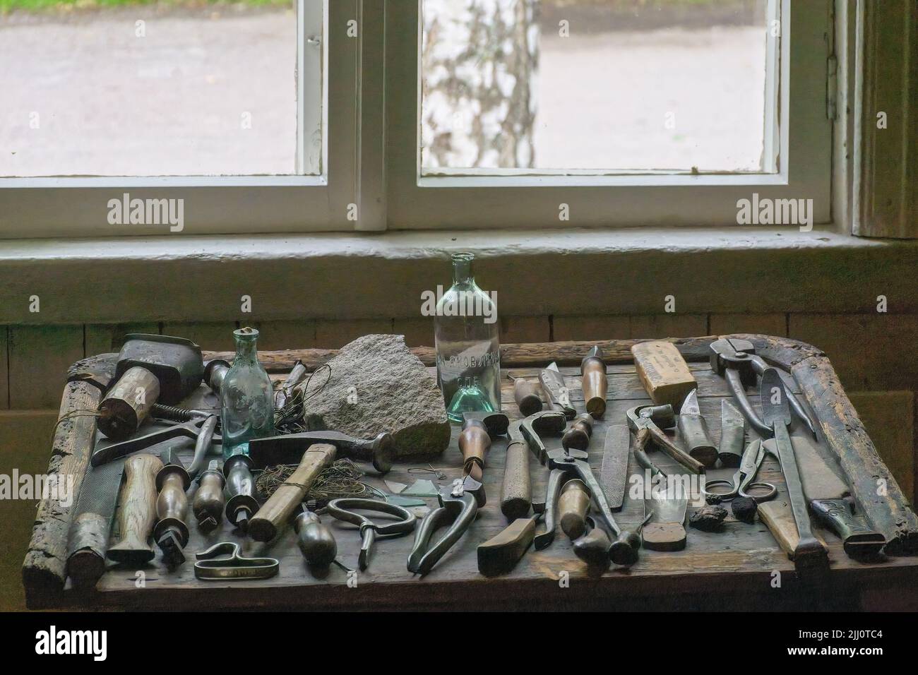 Shoemaker´s tools on table by window at Amuri Museum of historic ...