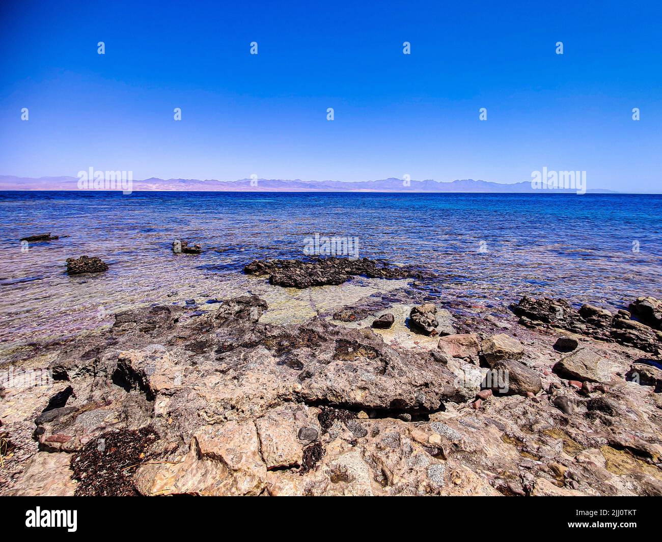 Seashore in Ras Shitan, Sinai, Egypt with Rocks and water Stock Photo ...