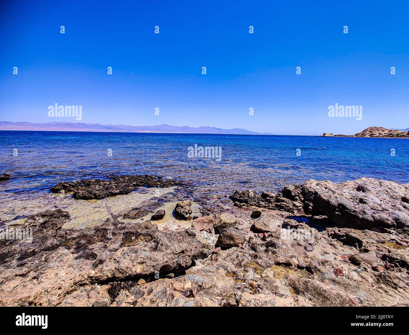 Seashore in Ras Shitan, Sinai, Egypt with Rocks and water Stock Photo ...