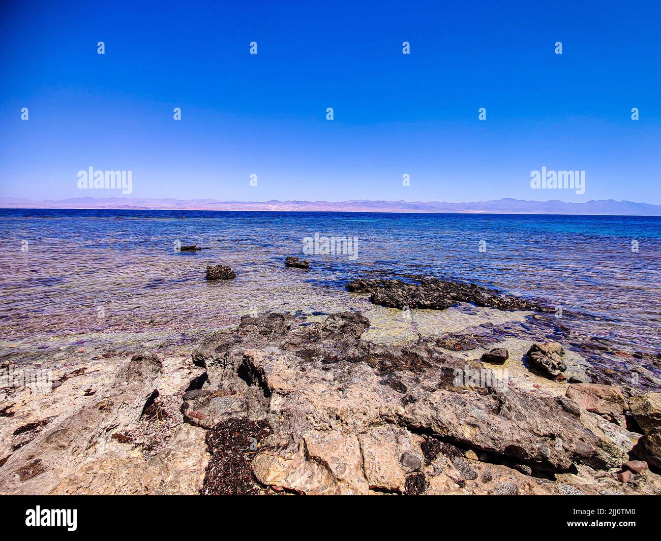 Seashore in Ras Shitan, Sinai, Egypt with Rocks and water Stock Photo ...