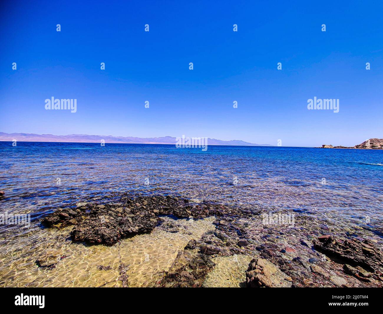 Seashore in Ras Shitan, Sinai, Egypt with Rocks and water Stock Photo ...