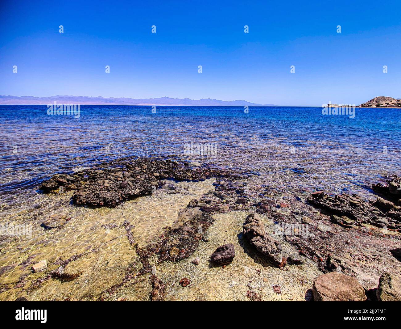 Seashore in Ras Shitan, Sinai, Egypt with Rocks and water Stock Photo ...