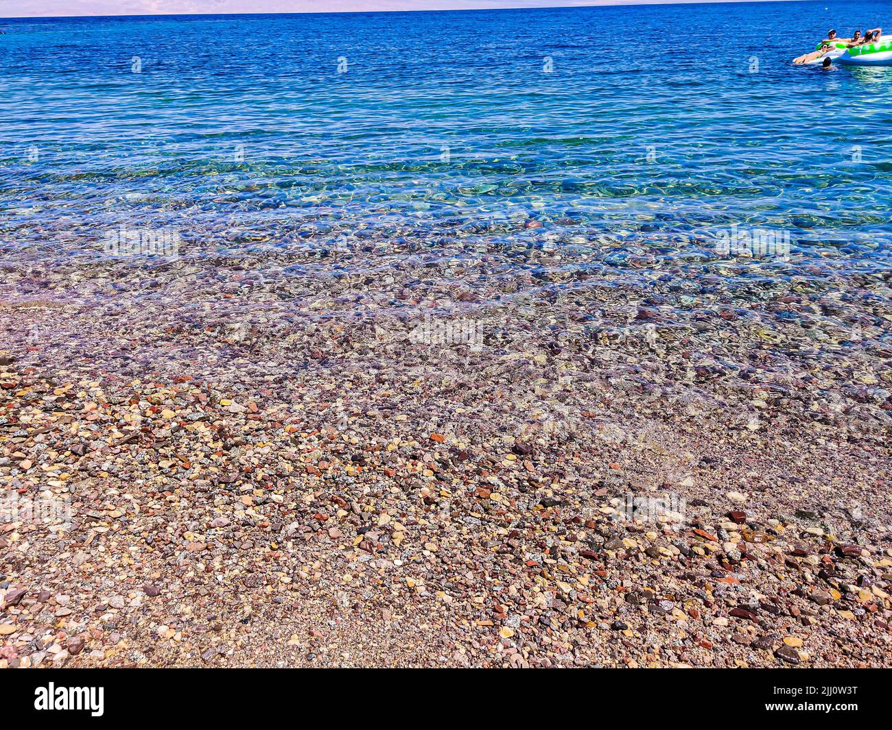 Rock and stones on the seashore on one of the beaches in Ras Shitan ...