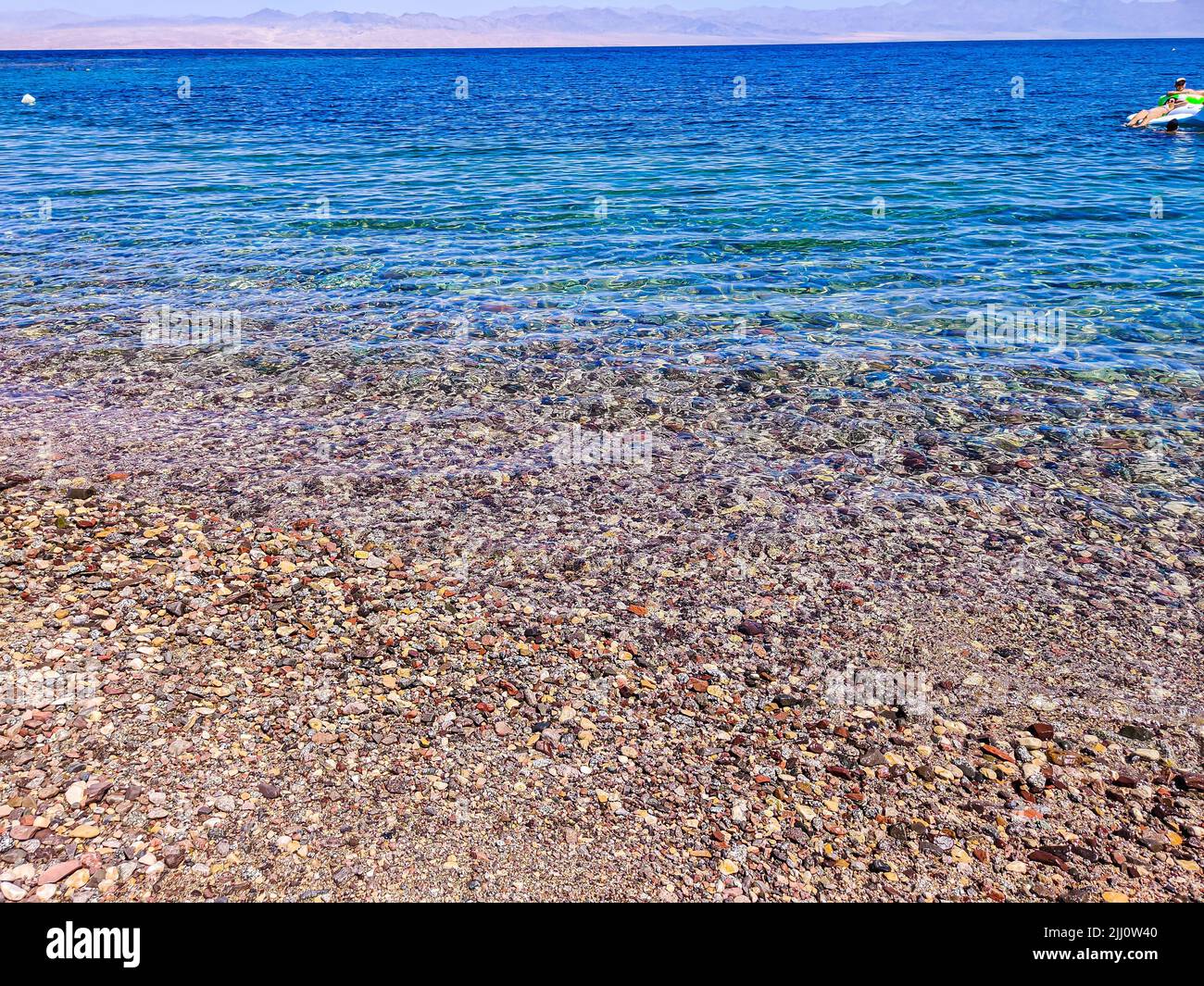Rock and stones on the seashore on one of the beaches in Ras Shitan ...