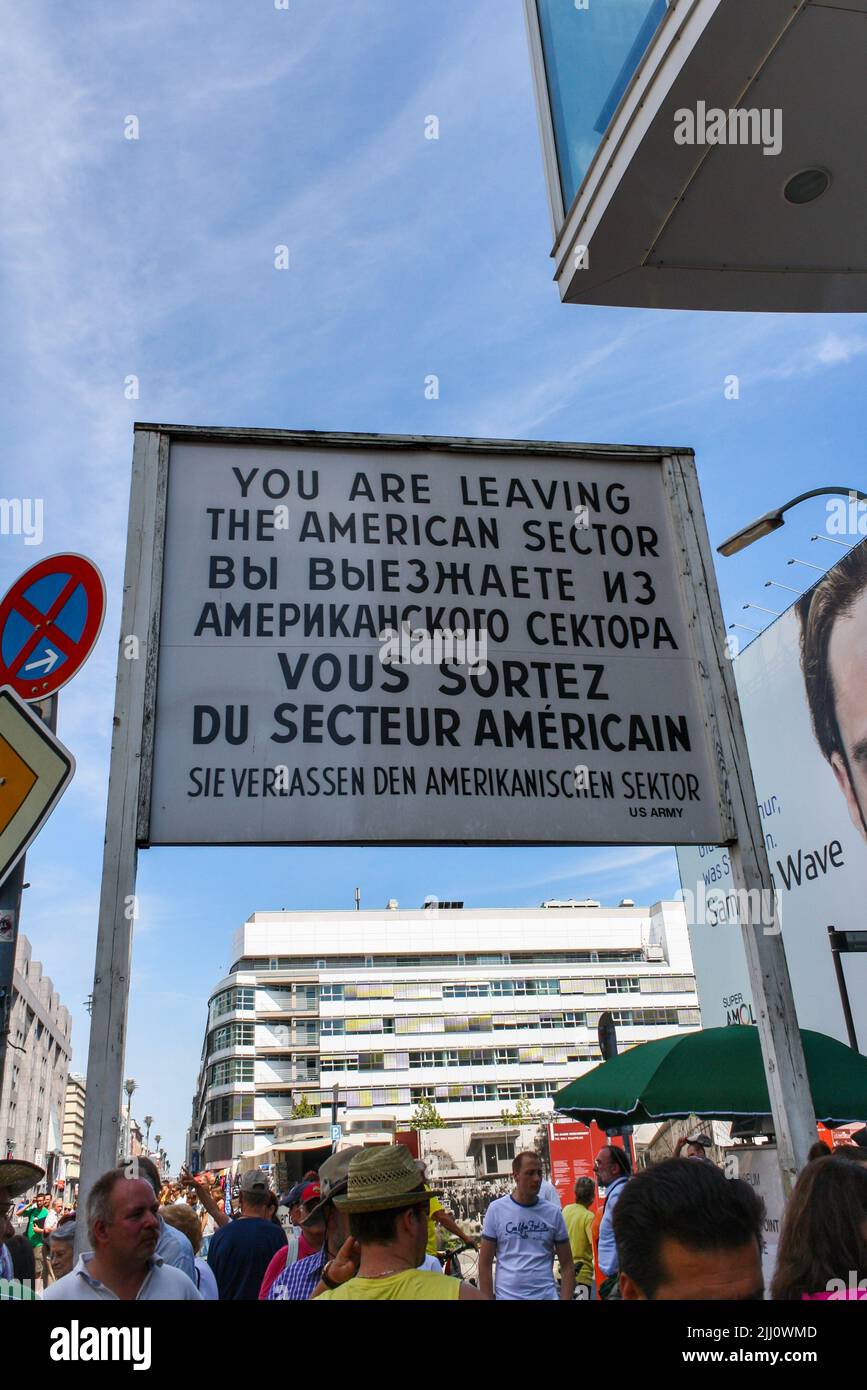 View of notification sign board at Checkpoint Charlie with crowd of ...