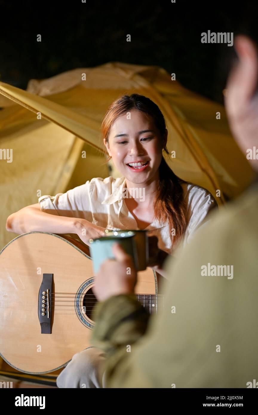 Charming young Asian female enjoy chatting with her friends, having a ...