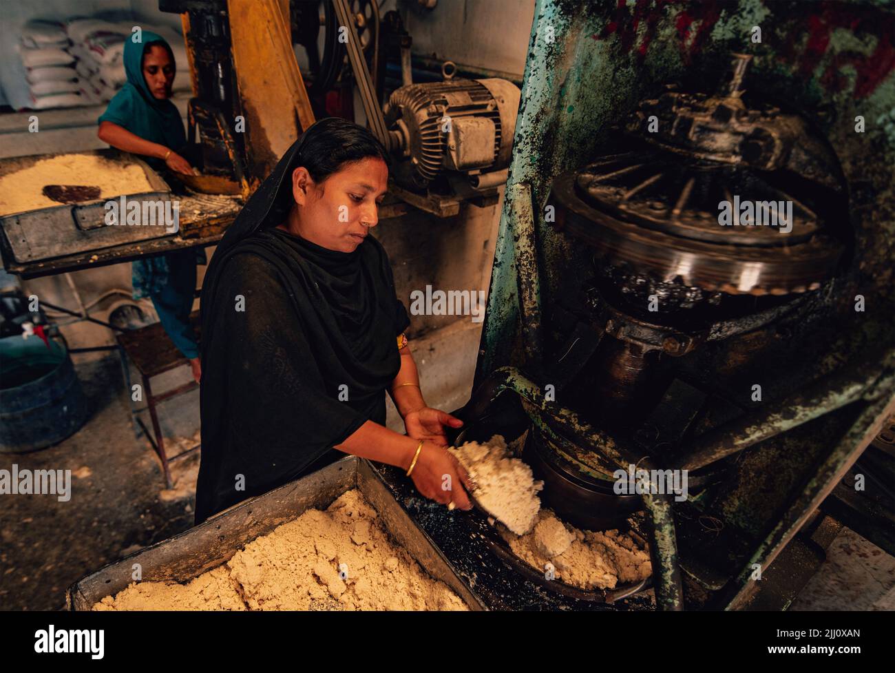 Workers making semai, traditional rice vermicelli noodles in Bangladesh ...