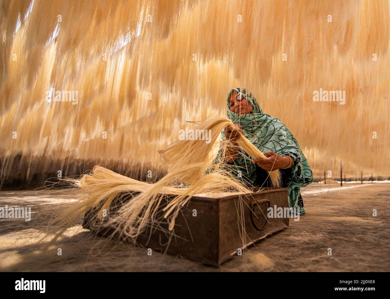 Workers making semai, traditional rice vermicelli noodles in Bangladesh ...