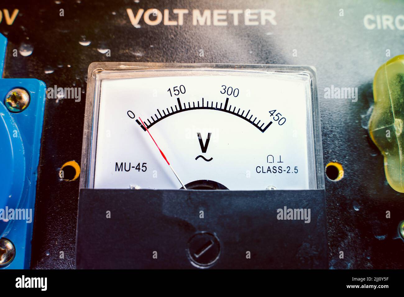 Mechanical voltmeter close up. Voltage measuring device on a gasoline ...