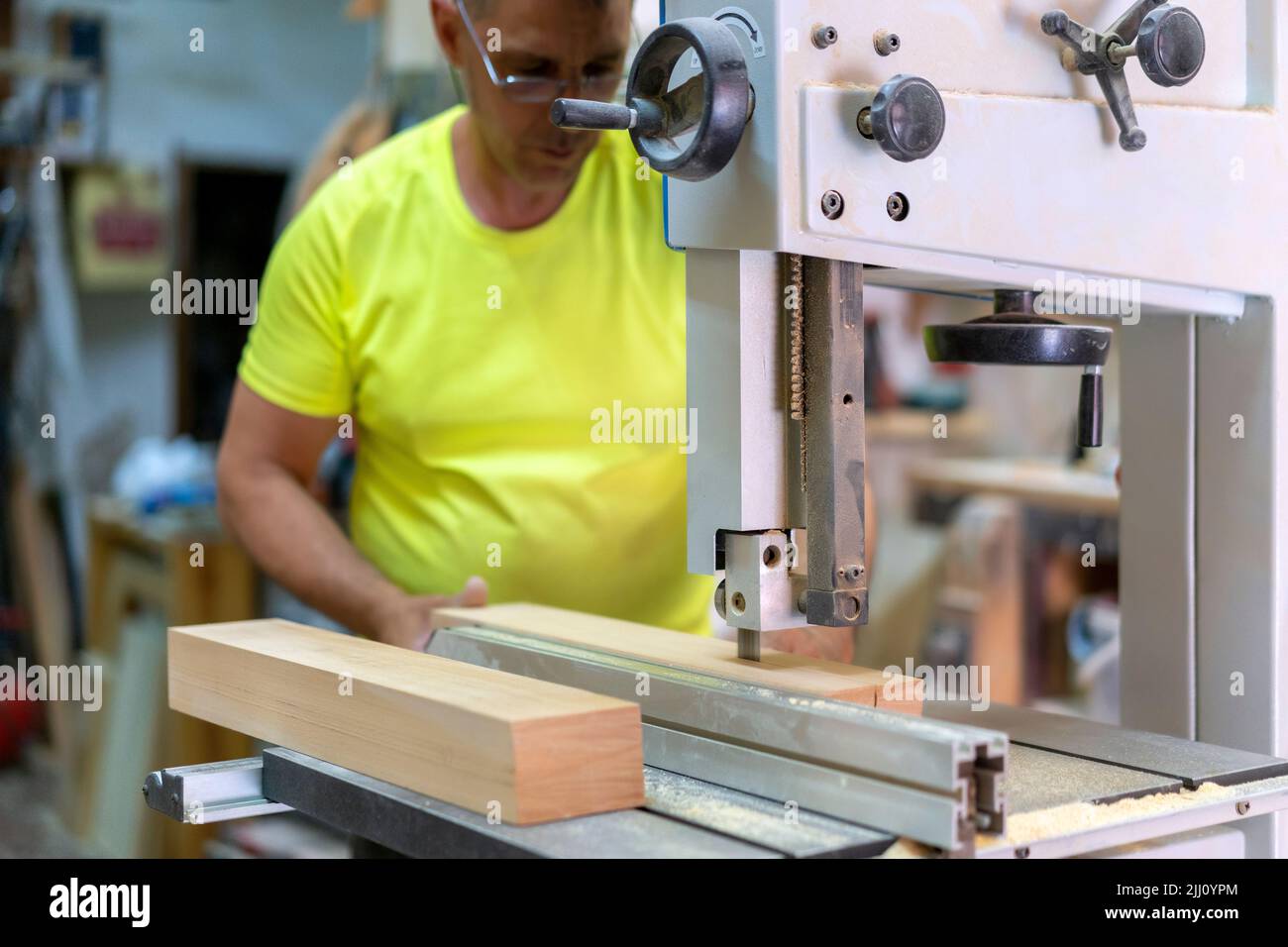 master carpenter adjusting his cutting machine in his workshop Stock ...