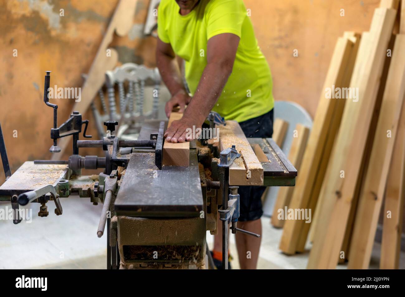 master carpenter preparing the wood in his workshop to work Stock Photo ...