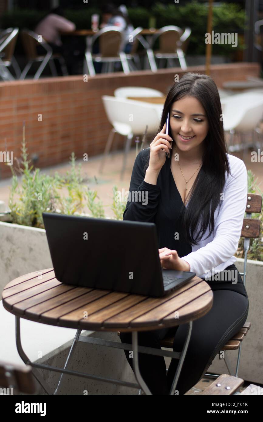Pretty girl working on laptop outdoor. Business woman working outdoor ...