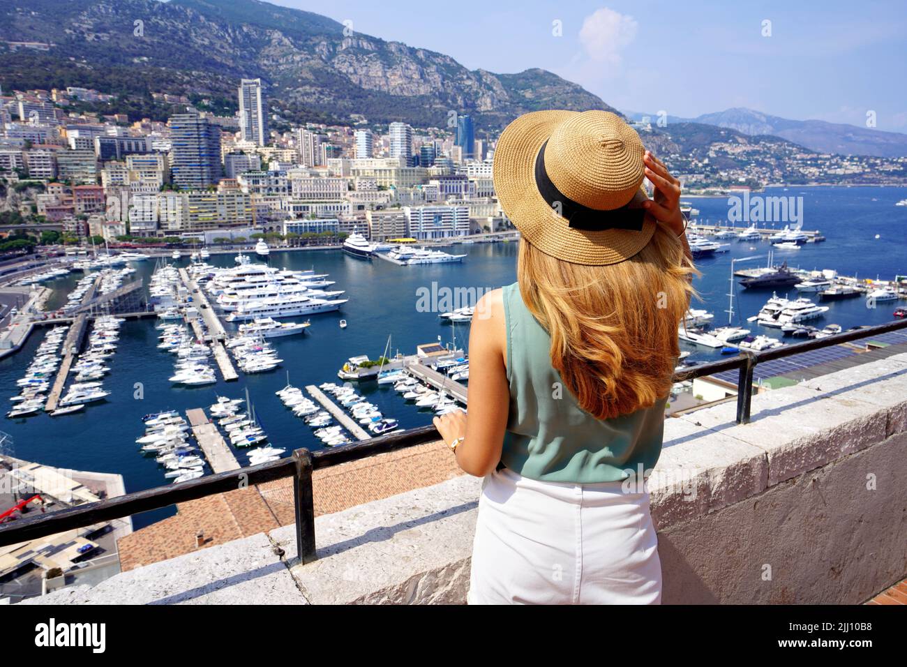 Holidays in Monaco. Beautiful woman in Monte-Carlo looking cityscape ...
