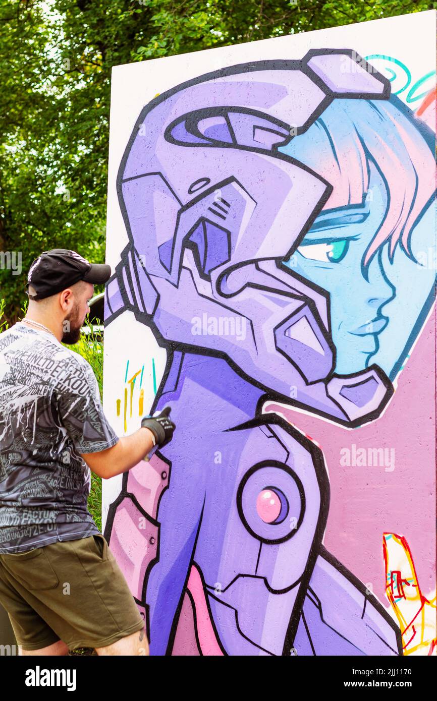 Urban graffiti near City Garden. Work is drawing portrait of fantastic ...