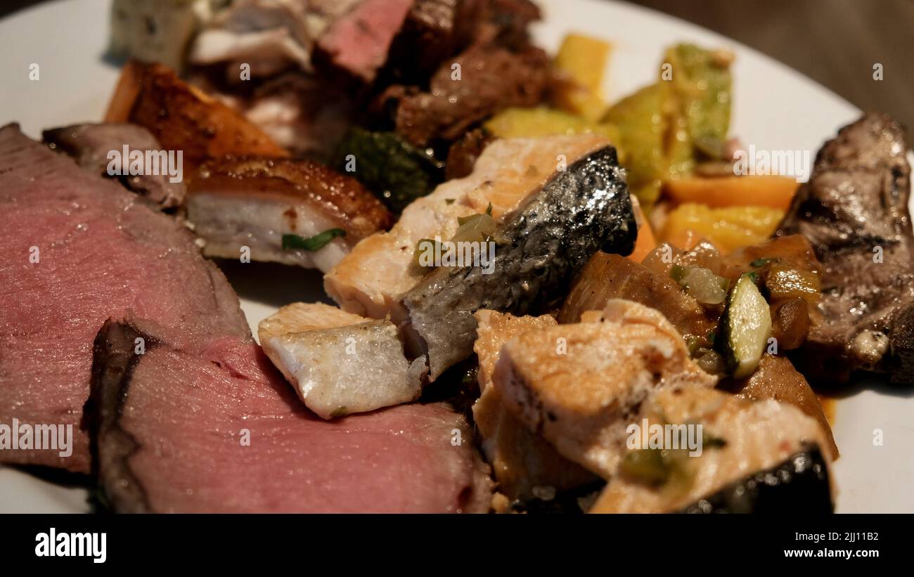 Meat and Fish Plate at International Buffet Stock Photo - Alamy