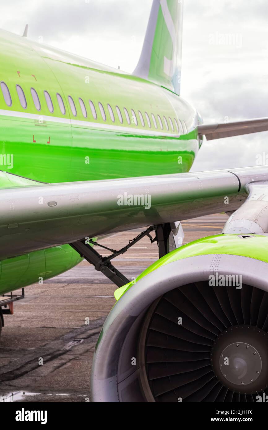green airplane and turbine detail on cloudy sky background,transport ...