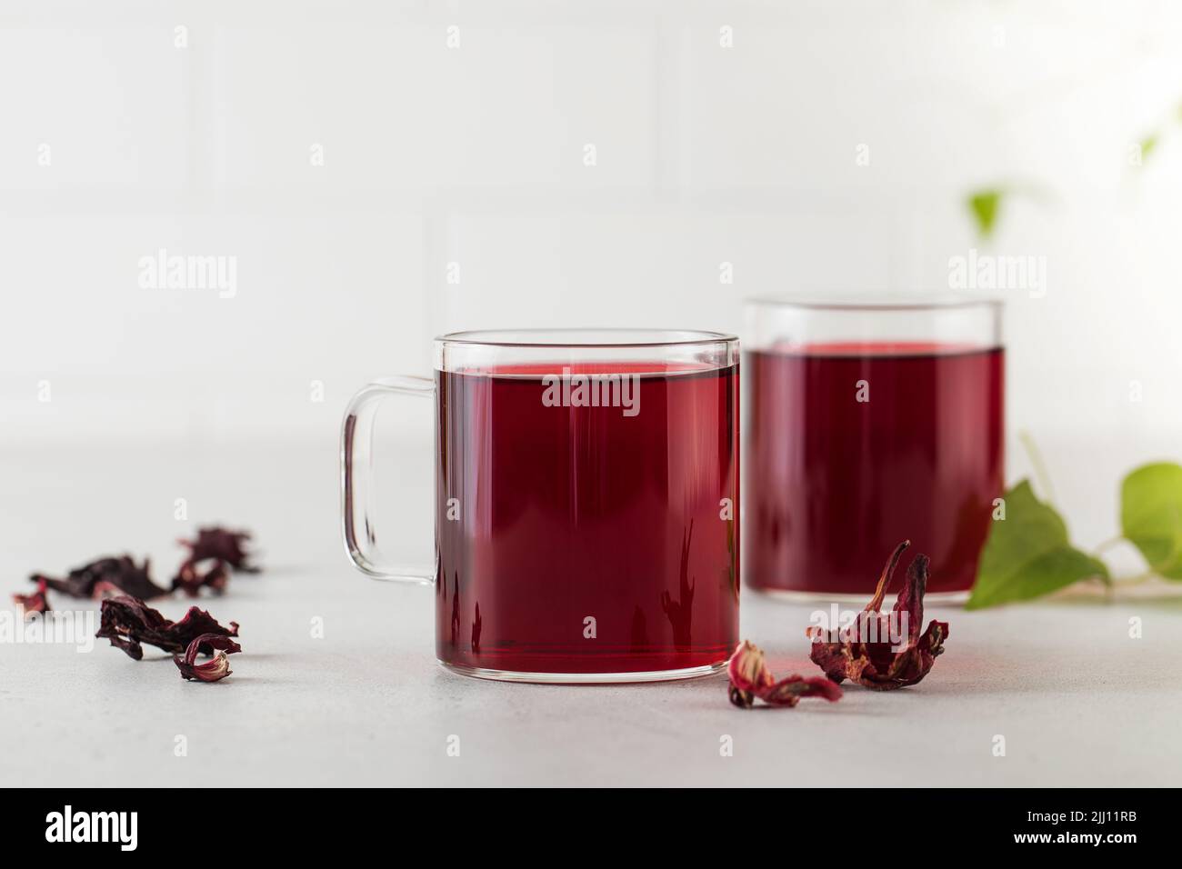 Herbal tea made from hibiscus petals in a transparent cup Stock Photo ...