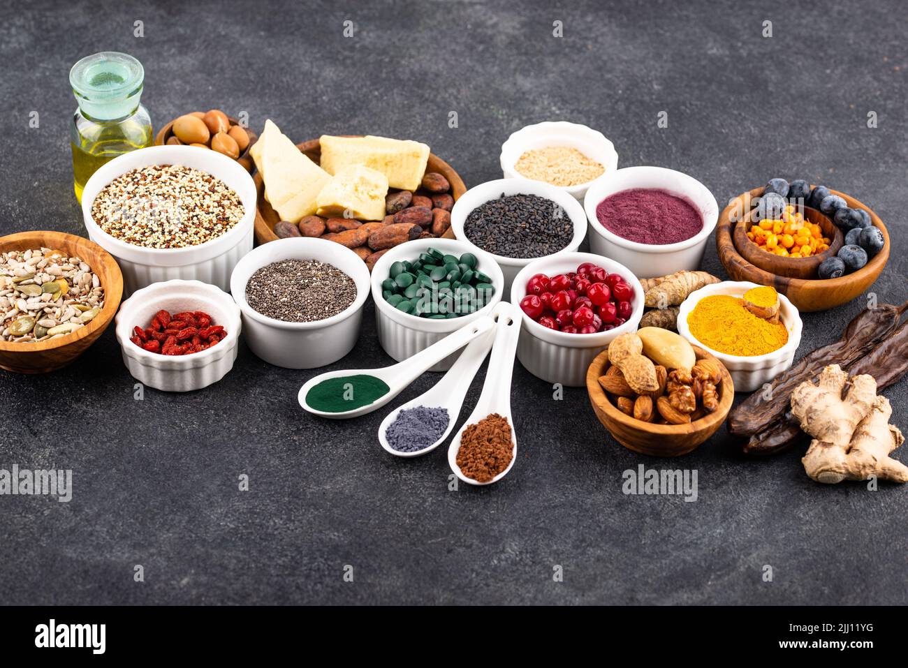 Various superfoods and healthy food supplement Stock Photo - Alamy