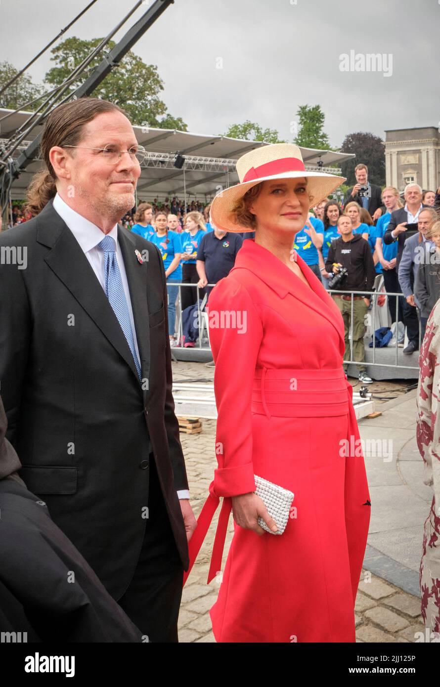 Princess Delphine of Belgium (R) and James O'Hare (L) attend a parade ...