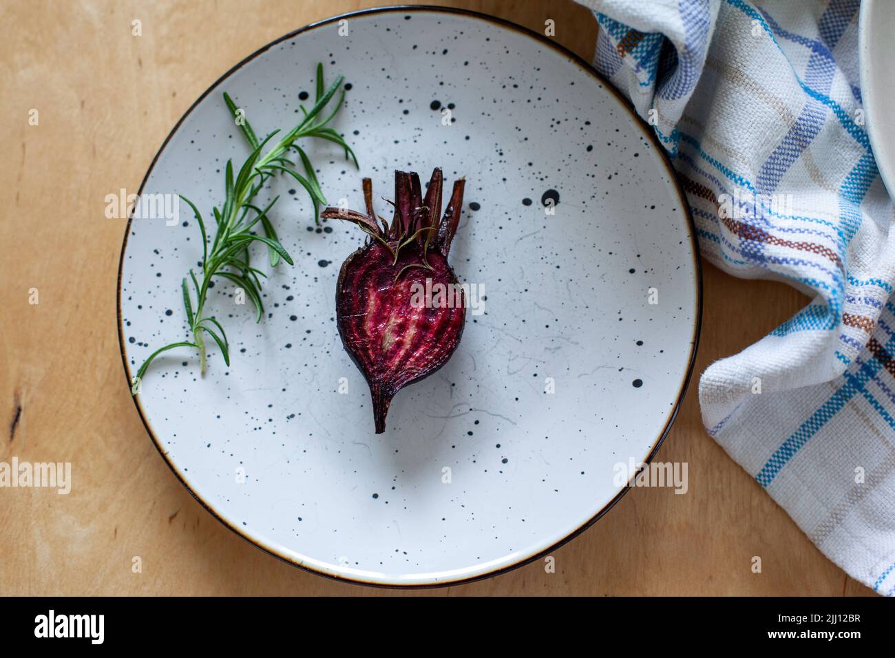 Roasted young half beet with rosemary and sea salt Stock Photo - Alamy