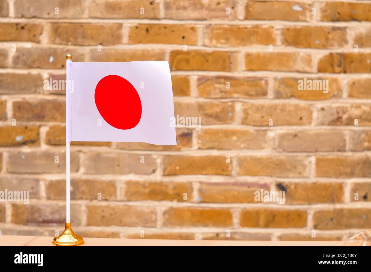 Close up of national flag of Japan round red circle on white background ...