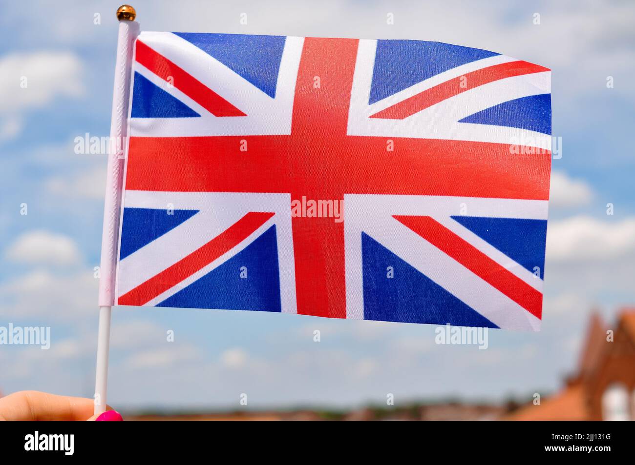 The national union jack flag of Great britain red white and blue colors ...