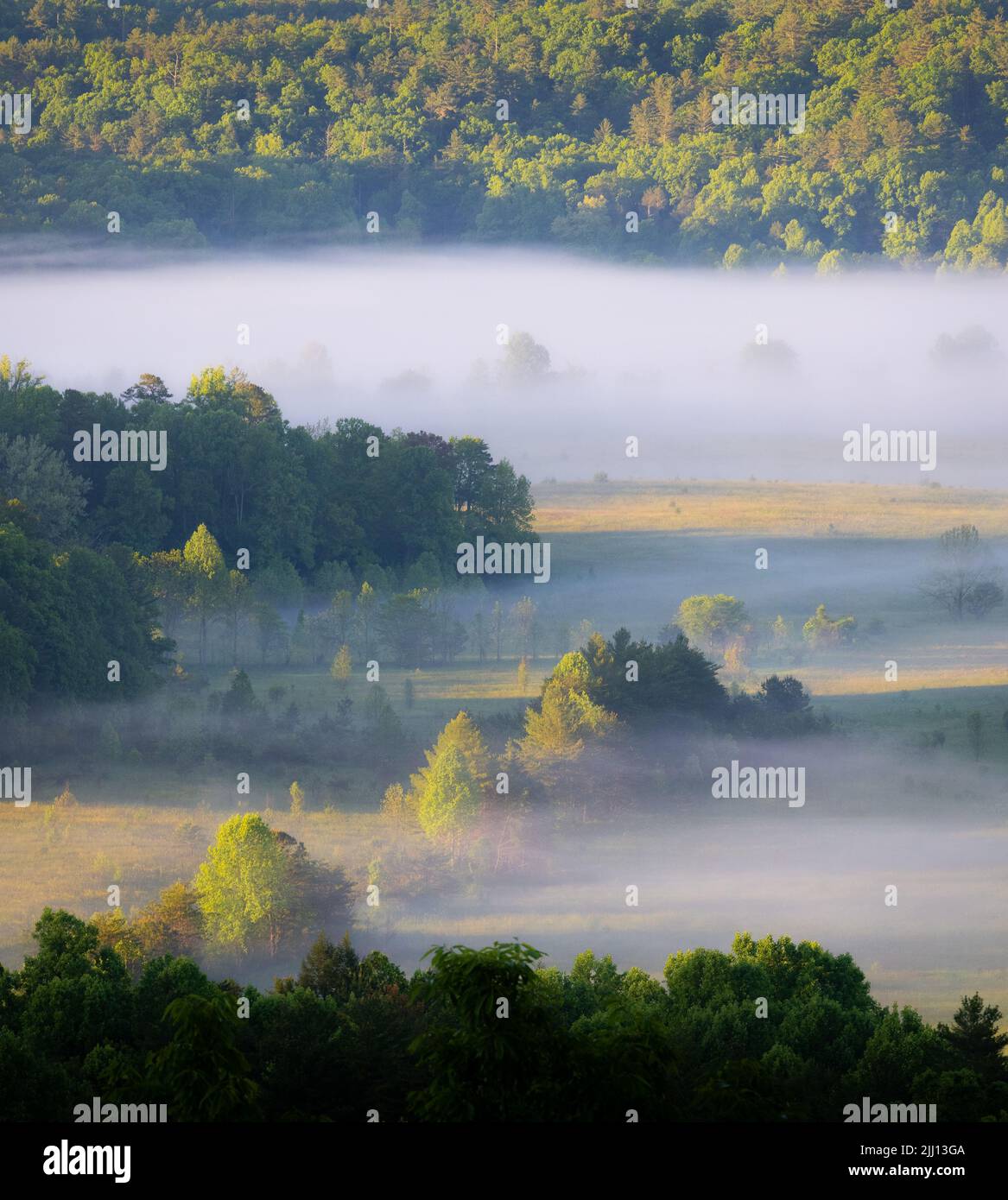 The Great Smoky Mountains range covered by mist during the sunrise ...