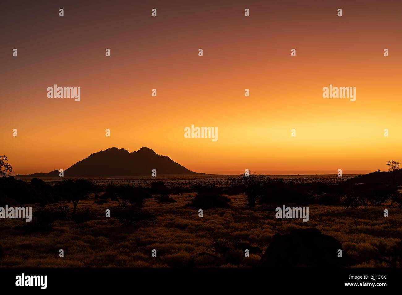 An intense and powerful sunset near the Spitzkoppe in Namibia. Bold ...